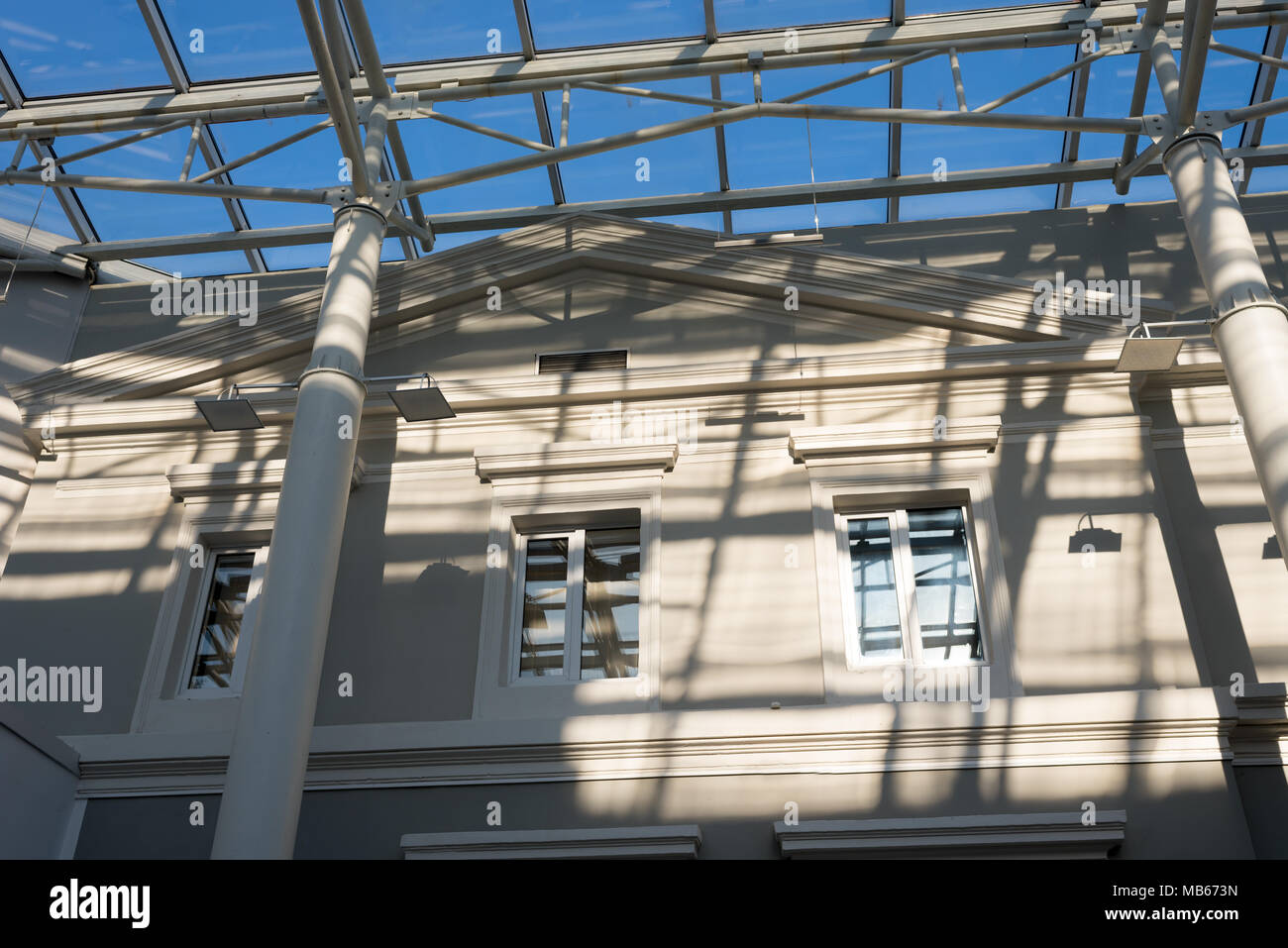 shadows from a metal roof structure on an old modernized building Stock ...