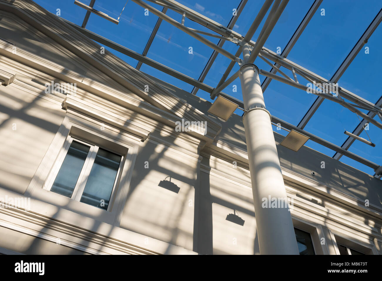 shadows from a metal roof structure on an old modernized building Stock ...