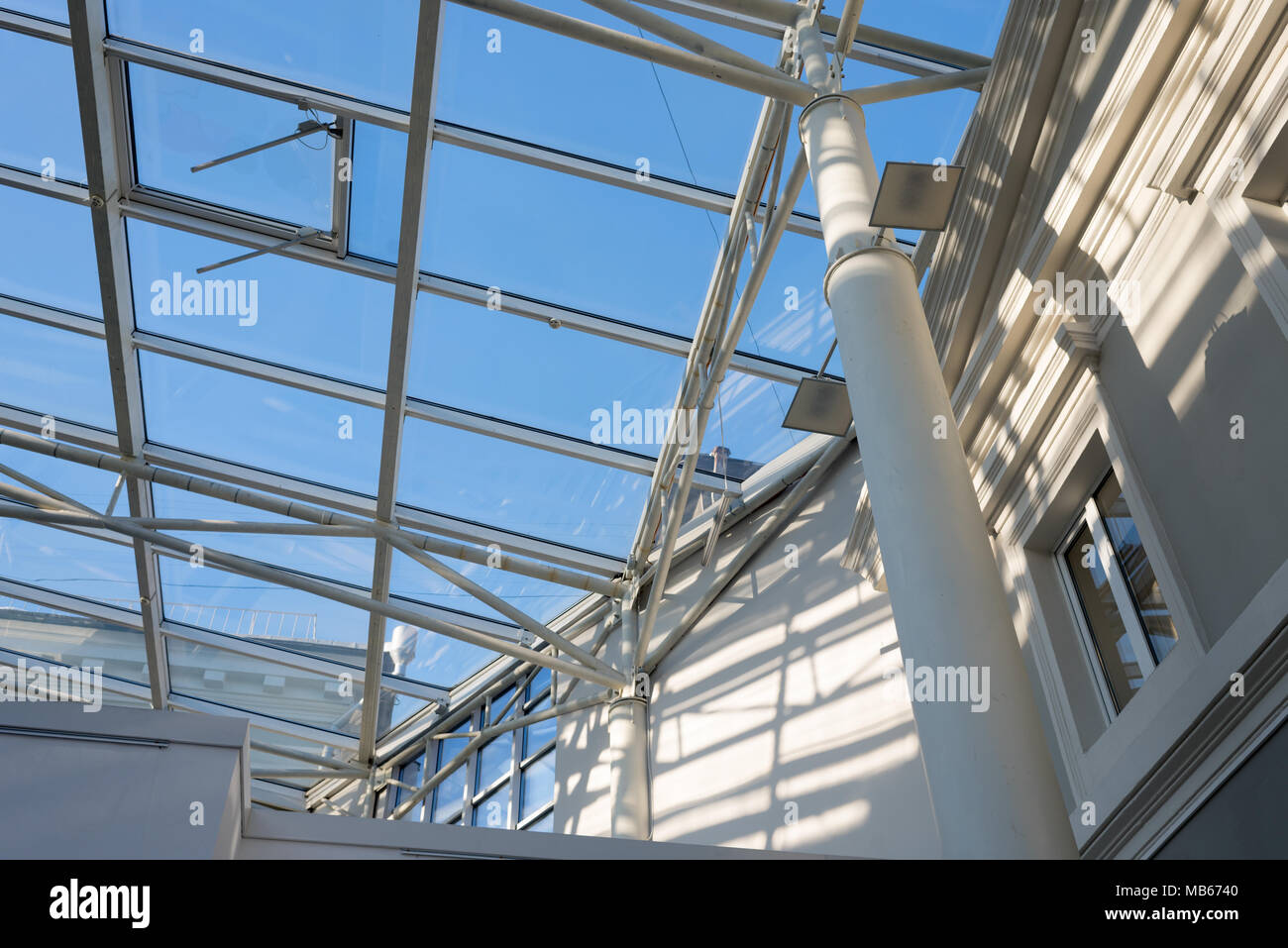 metal construction of a glass roof on a sunny day Stock Photo - Alamy