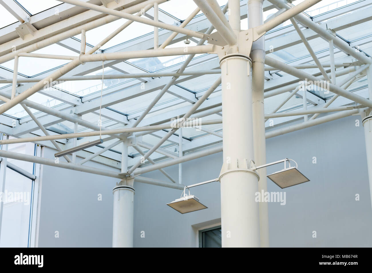 metal structure of a glass roof in a building Stock Photo - Alamy