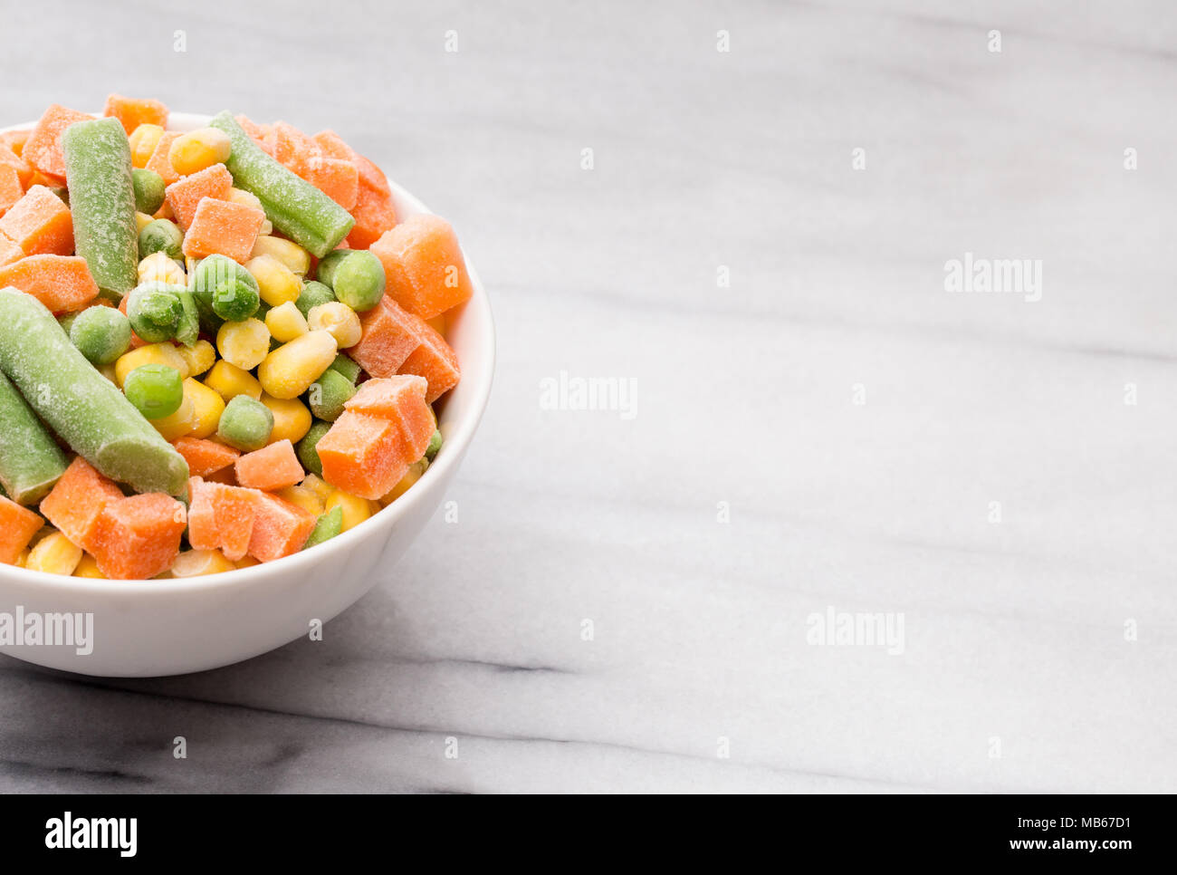 Mixed Vegetables Isolated on a White Marble Background Stock Photo - Alamy