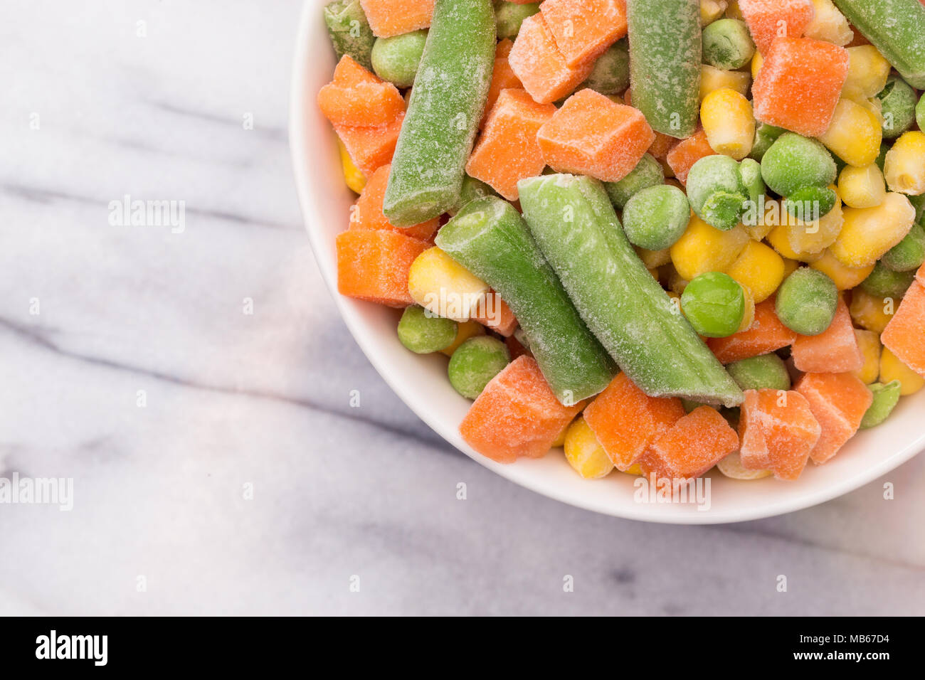 Mixed Vegetables Isolated on a White Marble Background Stock Photo - Alamy
