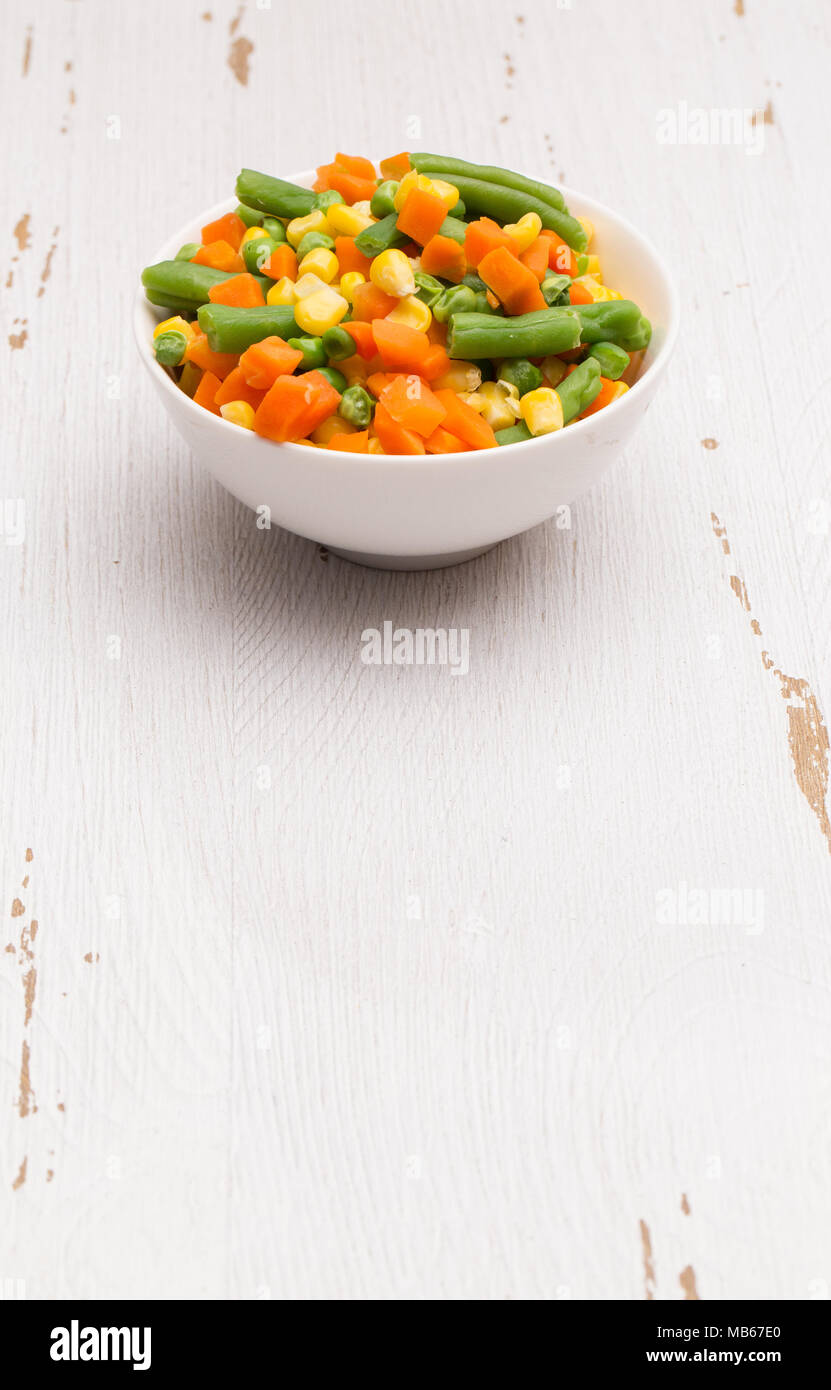 Steamed Mixed Vegetables Isolated on a White Wood Table Stock Photo - Alamy