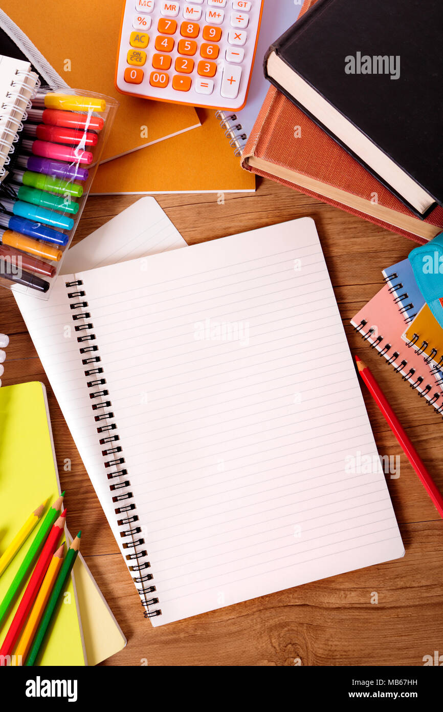 Student desk with blank writing book, copy space Stock Photo - Alamy