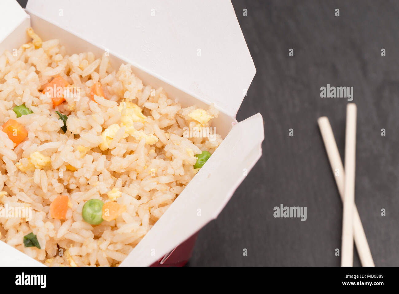 Vegetable Fried Rice in a Take Out Container Stock Photo - Alamy