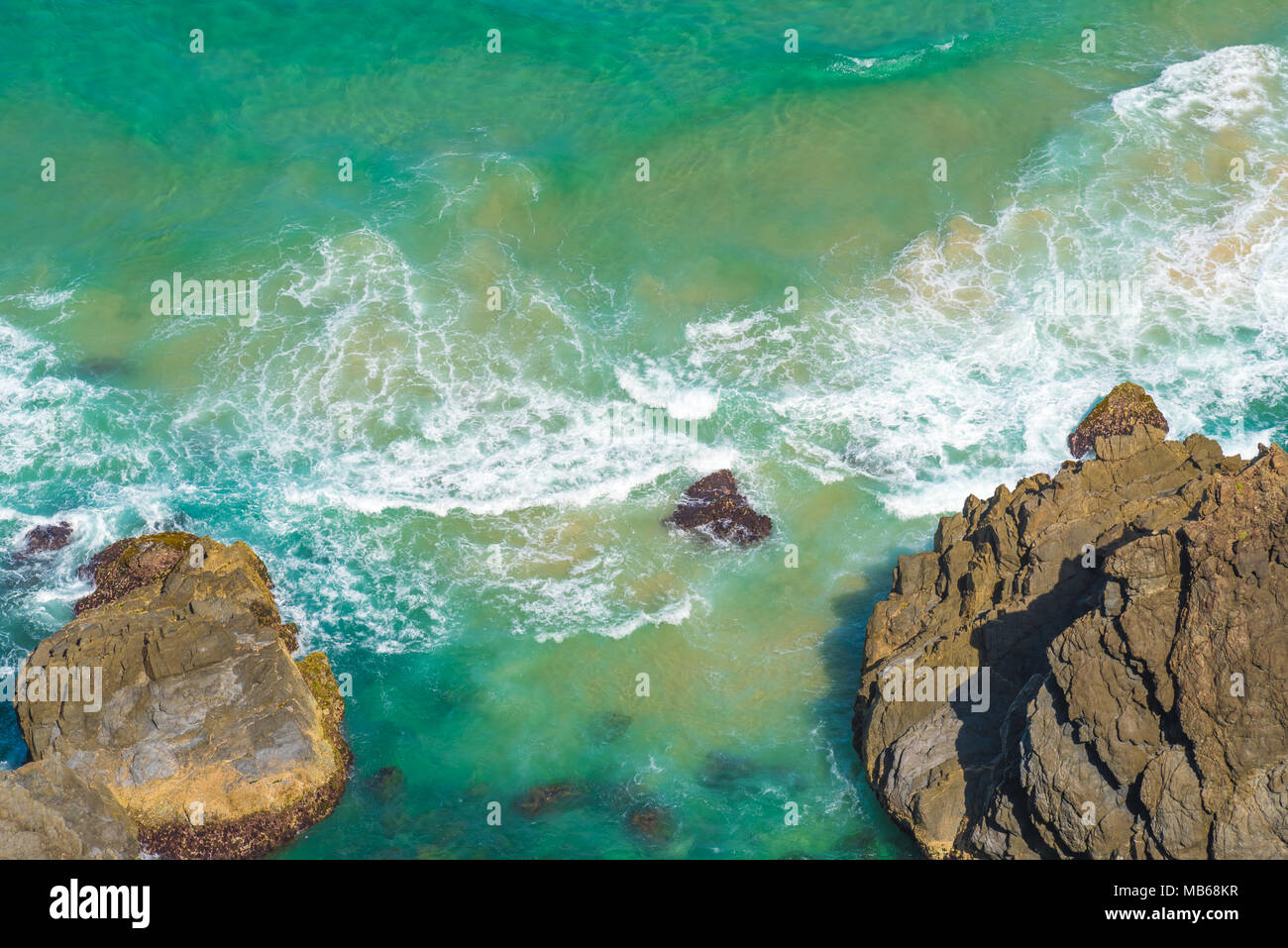 Aerial view over green turquoise water waves in Byron Bay, Australia ...