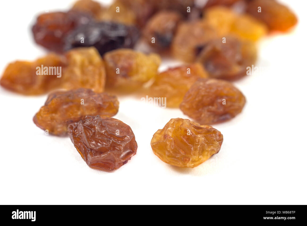 Dried grape raisins on a white background Stock Photo - Alamy