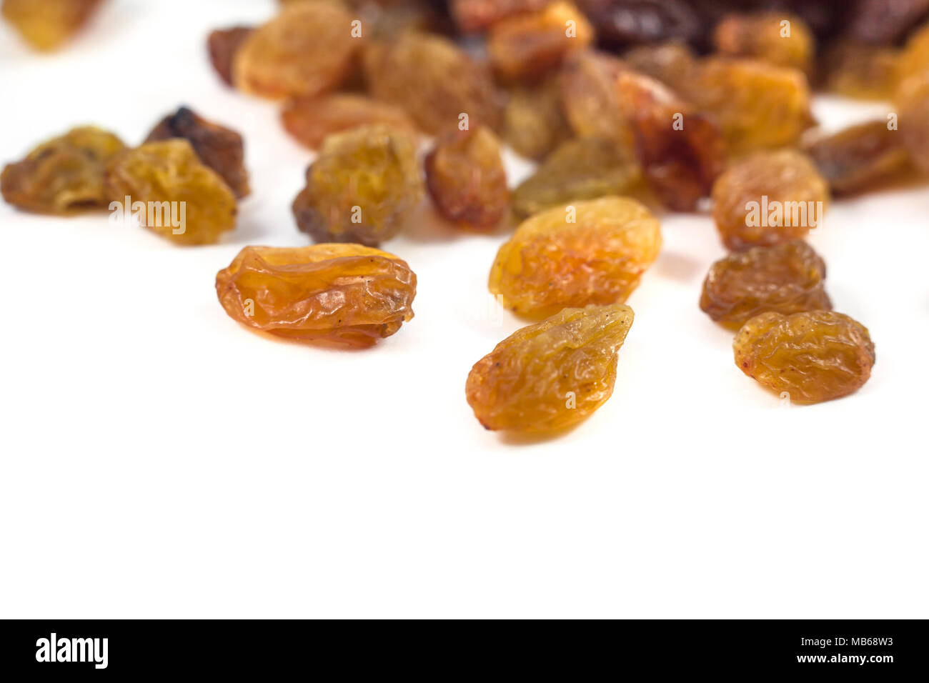 Dried grape raisins on a white background Stock Photo - Alamy