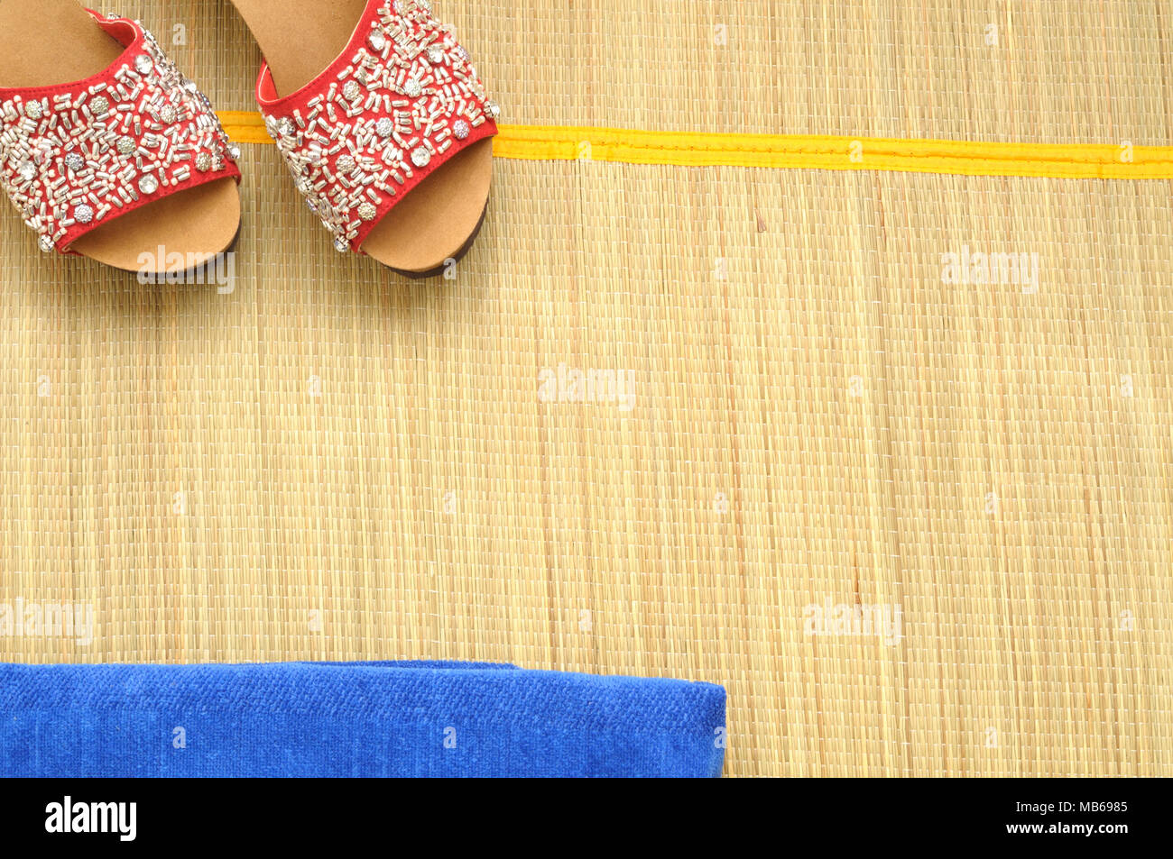 Summer background, with red sandals and large copy space, from above ...