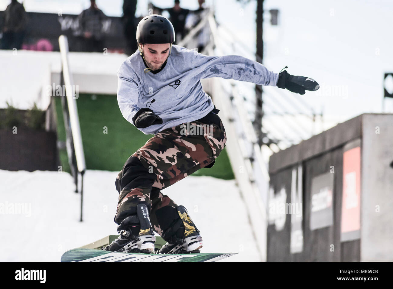 A snowboarder competes at the Air + Style Festival in Los Angeles, CA ...