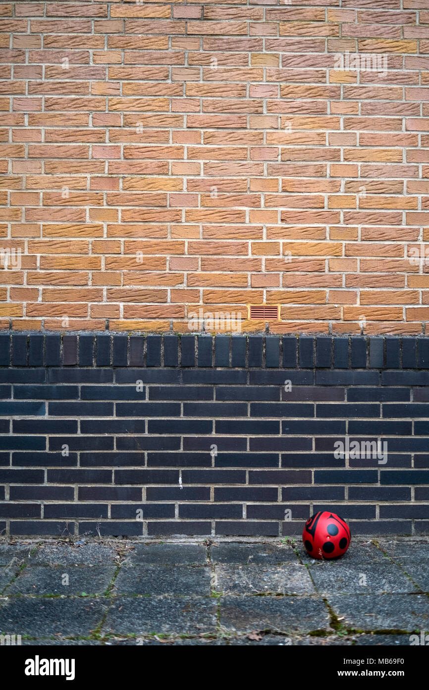 Soccer ball in a courtyard Stock Photo - Alamy