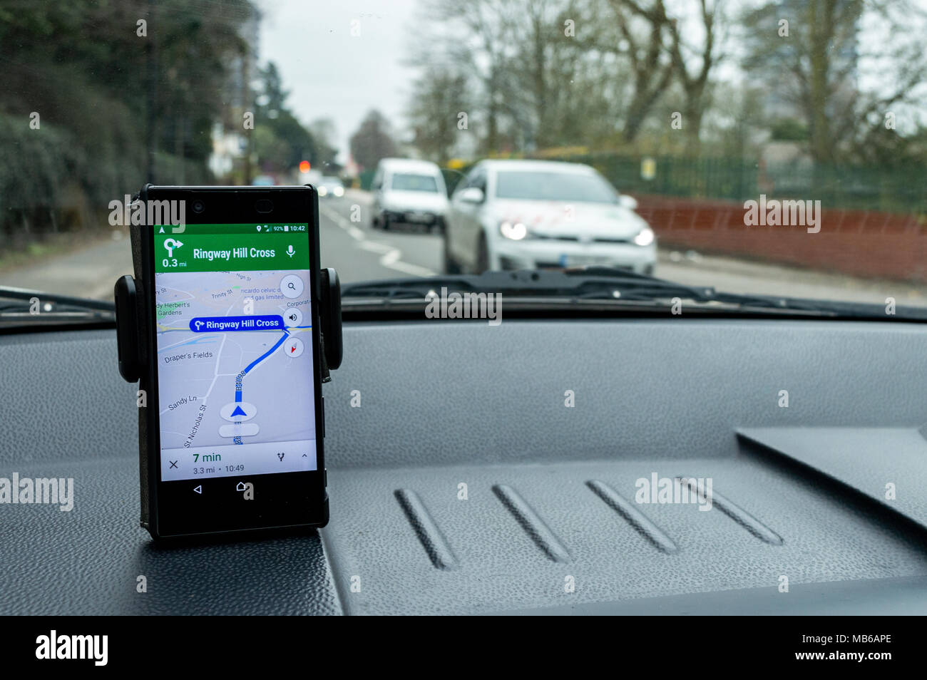 smartphone used as a sat nav on car dashboard Stock Photo - Alamy