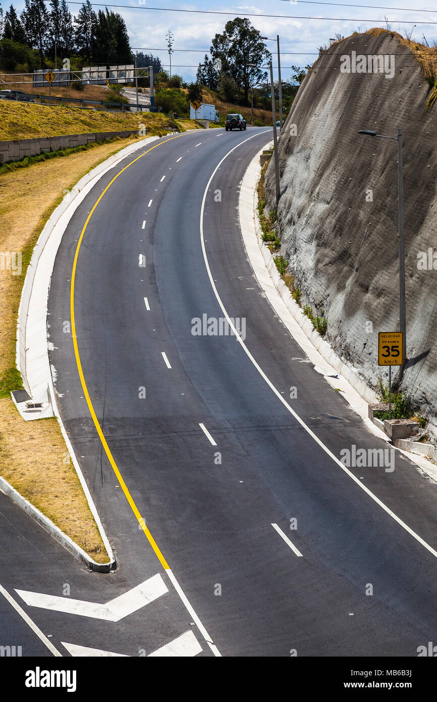 Segments of newly constructed asphalt highway with its white and yellow ...