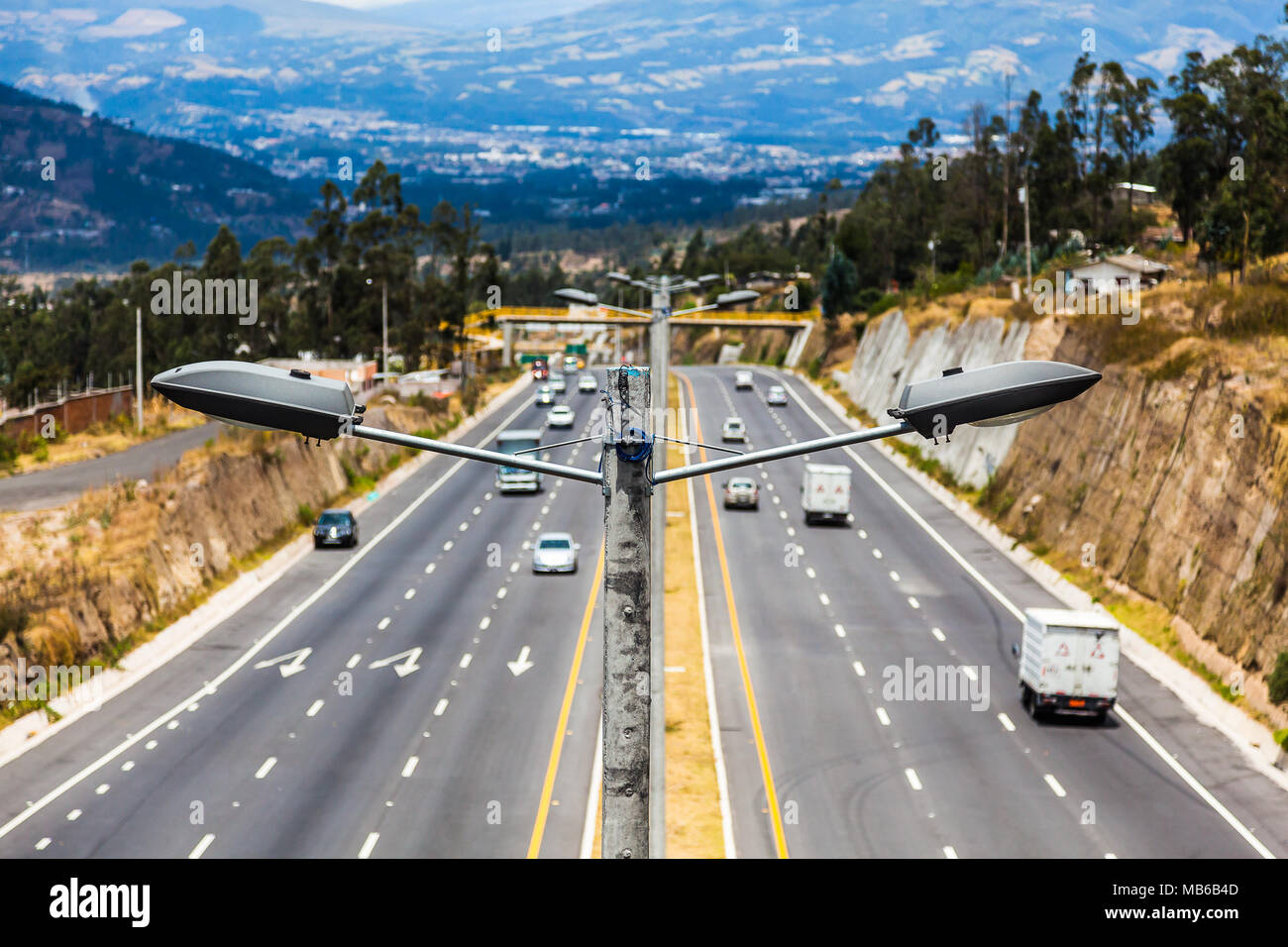 Segments of newly constructed asphalt highway with its white and yellow ...