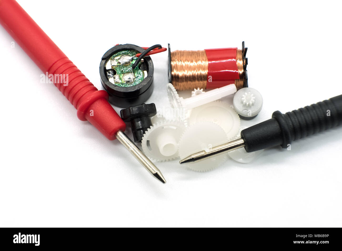 Two Meter Tester Probes & some Old Clock Parts Isolated on a white ...
