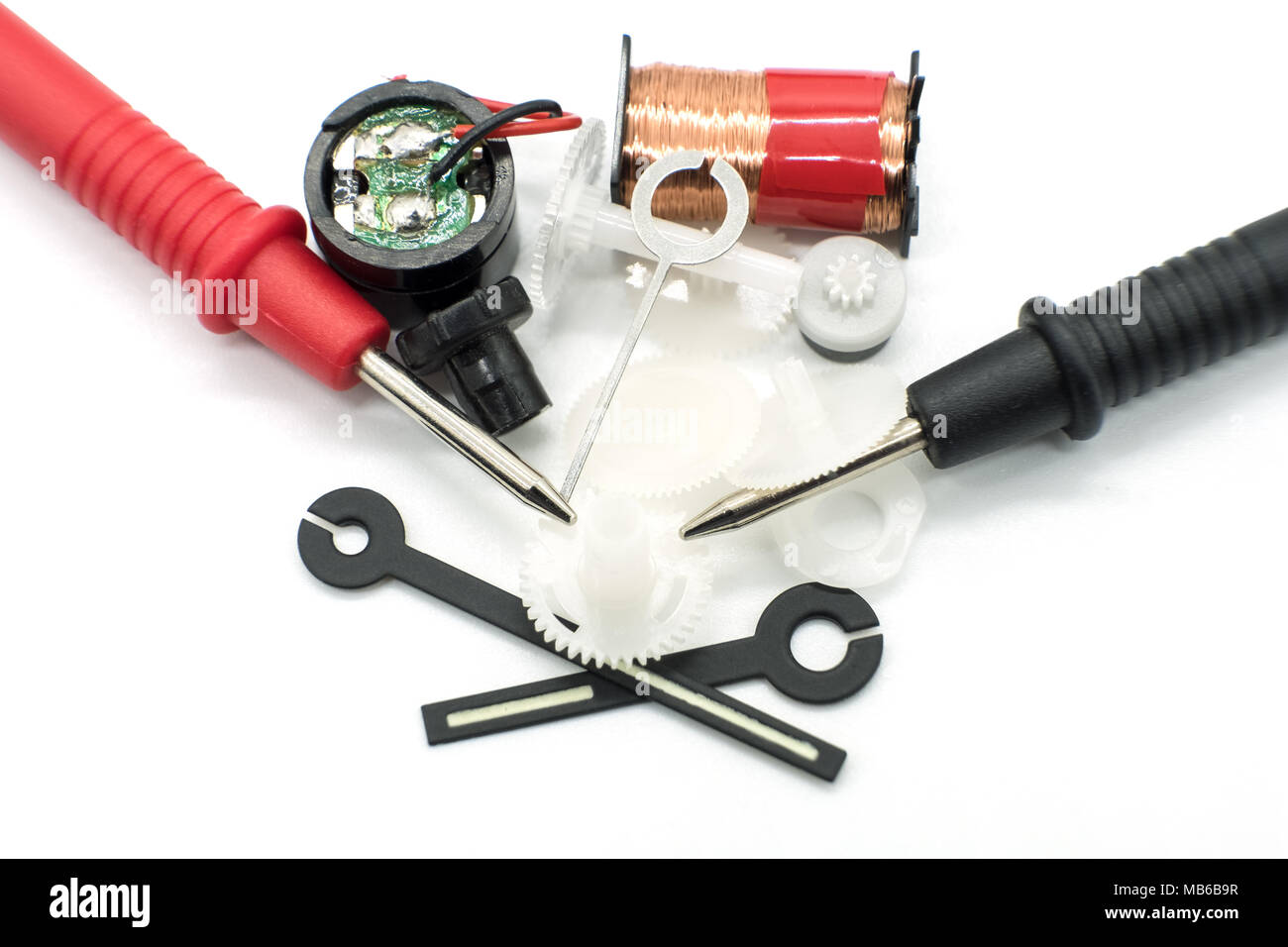 Two Meter Tester Probes & some Old Clock Parts Isolated on a white ...