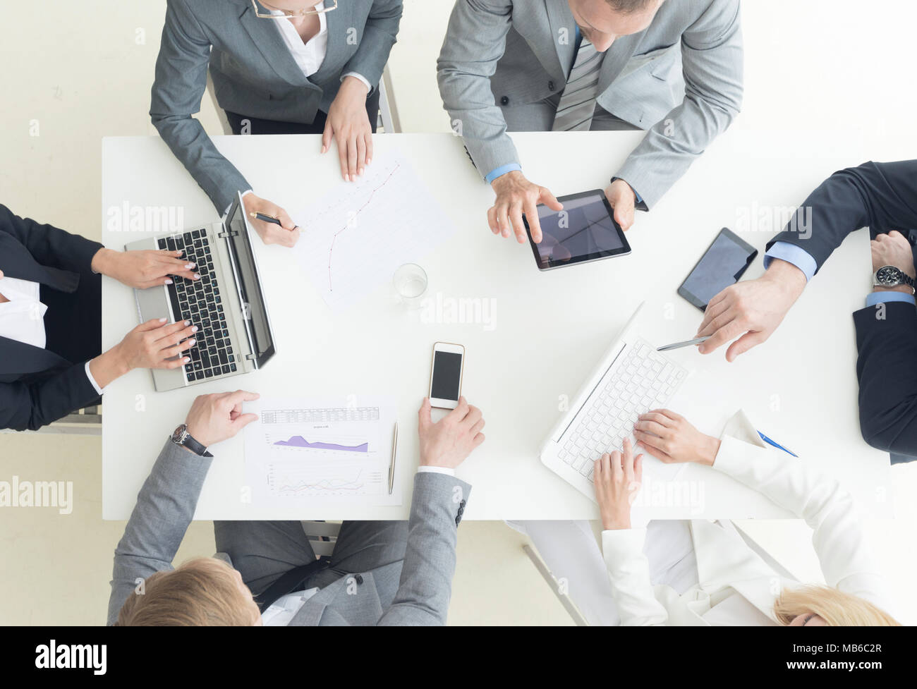 Business team meeting. People in office working with laptop computer ...