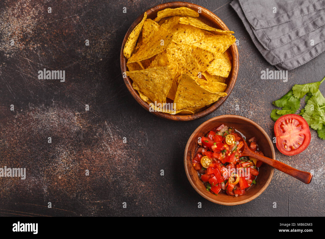 Mexican food concept. Nachos - corn totopos chips with tomato sauce ...