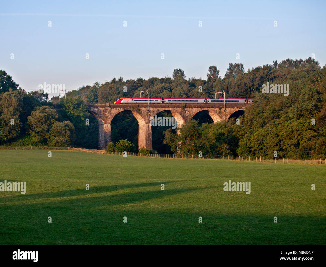 A Virgin Trains Pendolino train crossing the River Lowther viaduct on ...