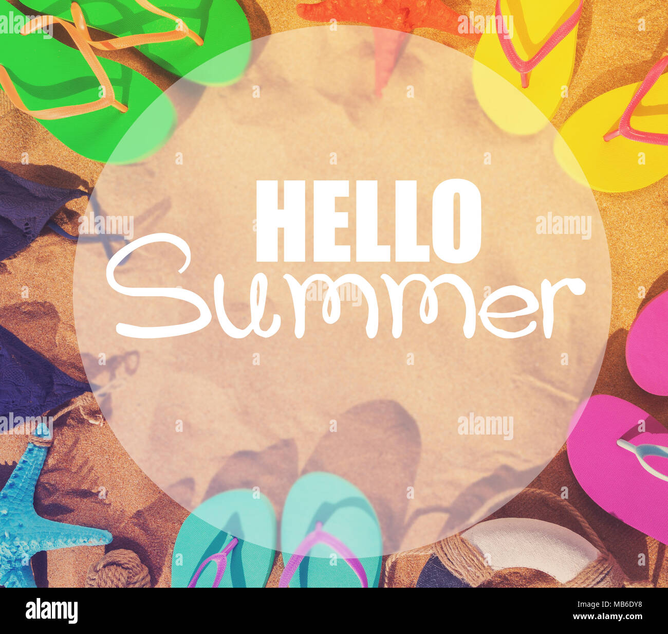 Summer beach fun - frame on sand with sandals and swimming suits with ...