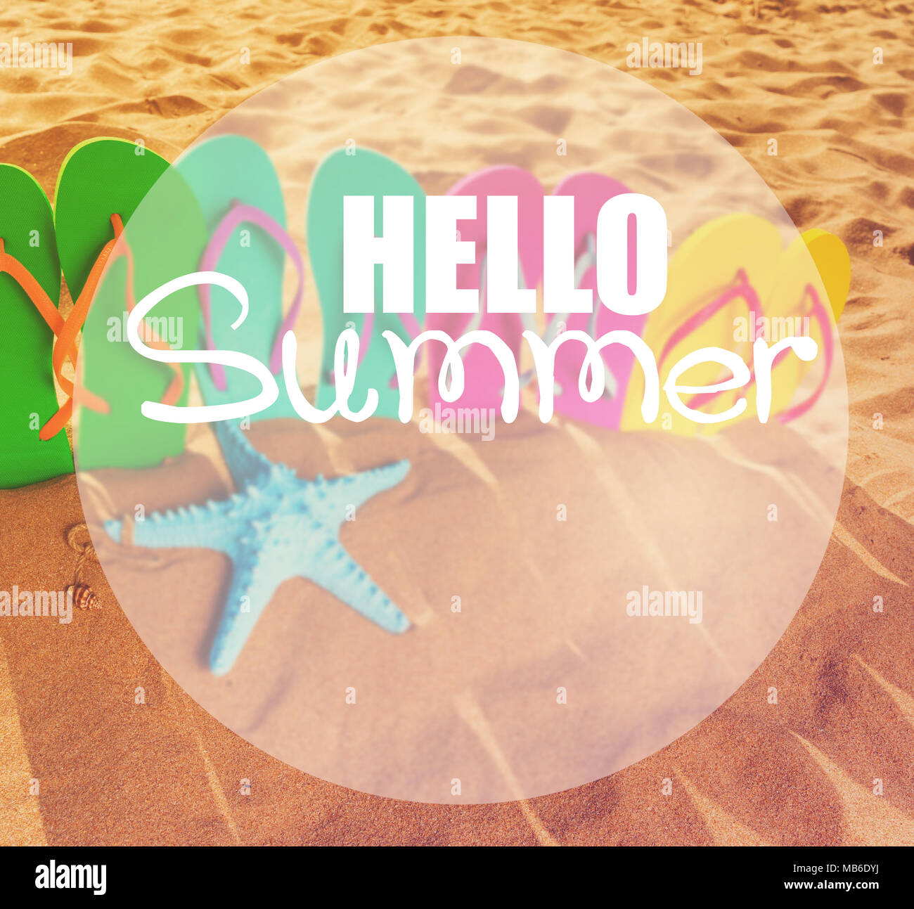 Summer beach fun - set of family sandals in sand on beach with hello ...