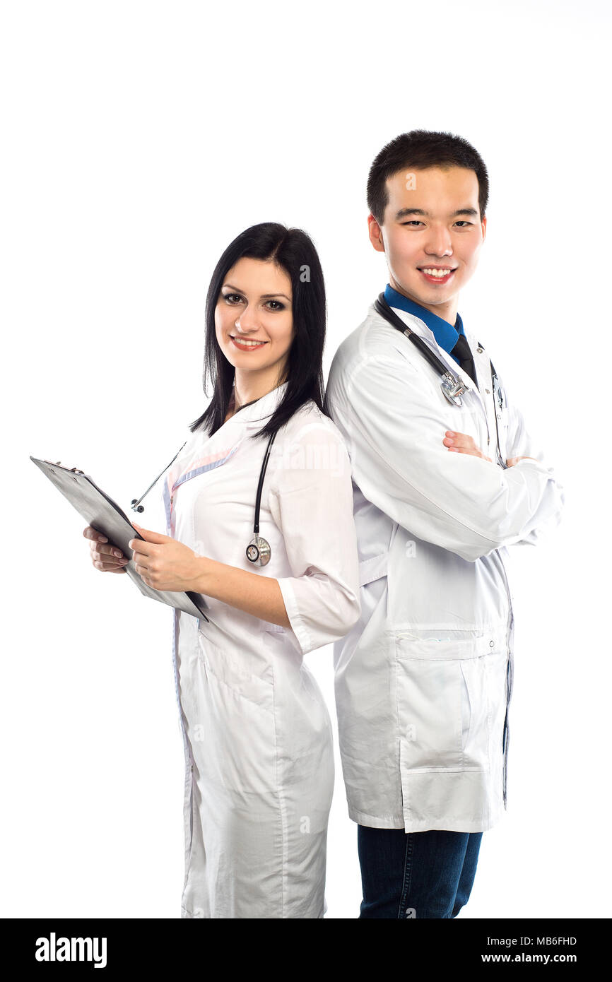 Asian doctor with a smiling happy Caucasian nurse or medical colleague ...