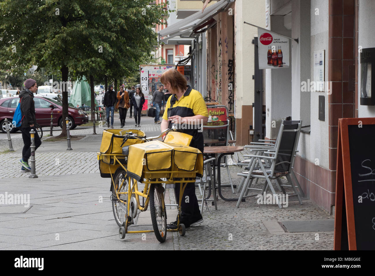 Post Woman, Berlin, Germany Stock Photo - Alamy
