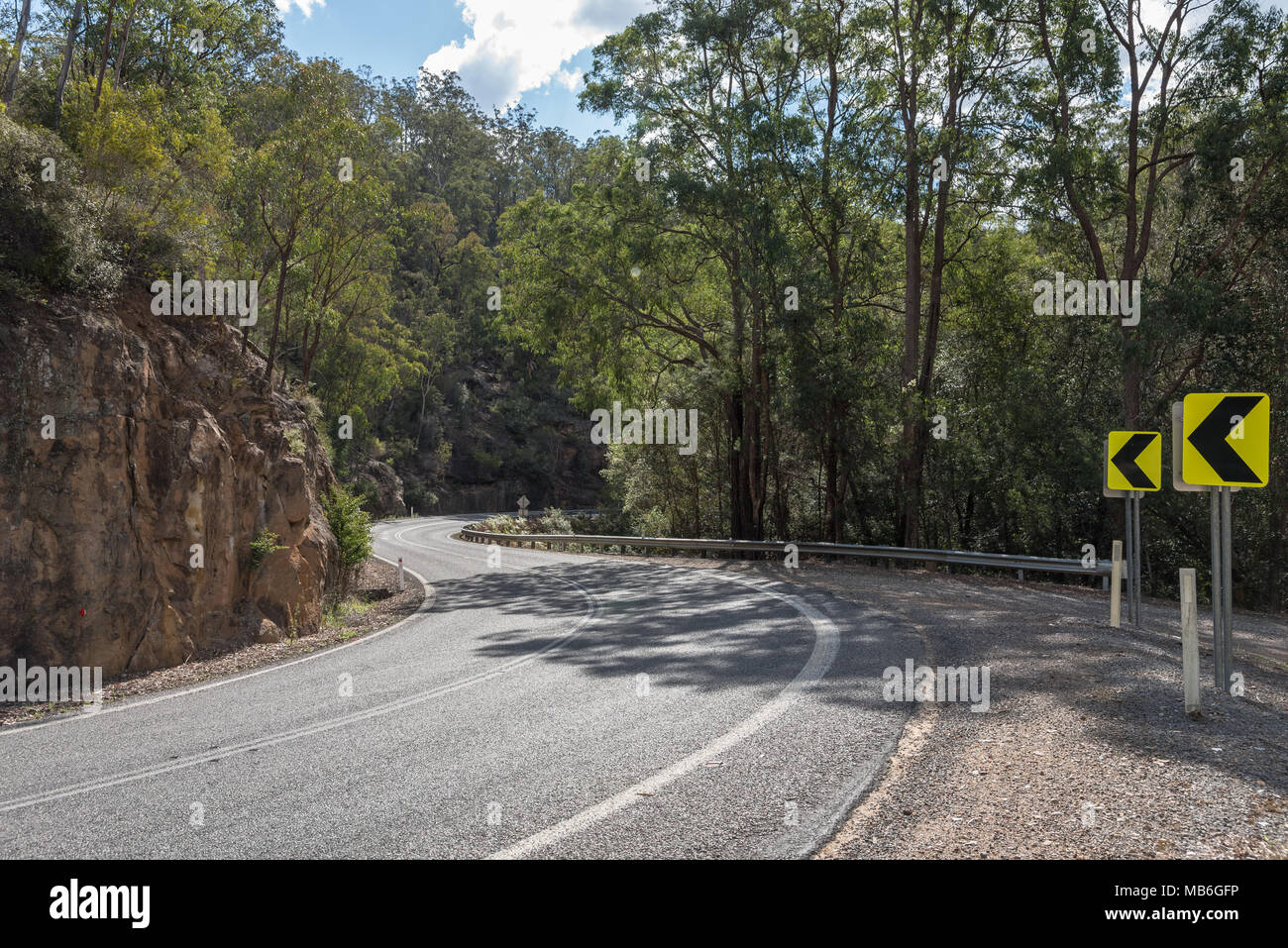 A curve on Putty Road while driving through the bush Stock Photo - Alamy