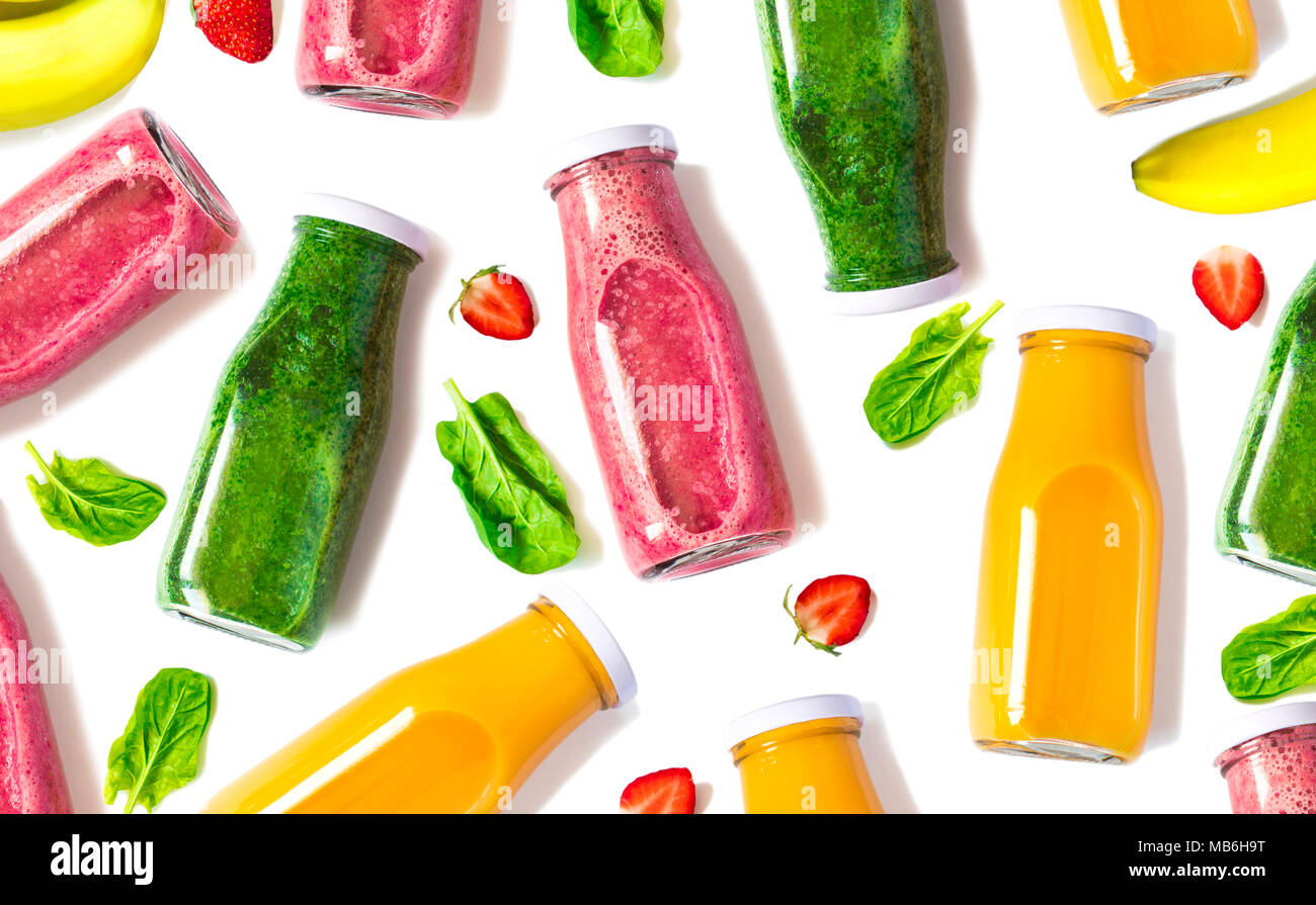 Colorful smoothies in bottles isolated on white background, top view ...