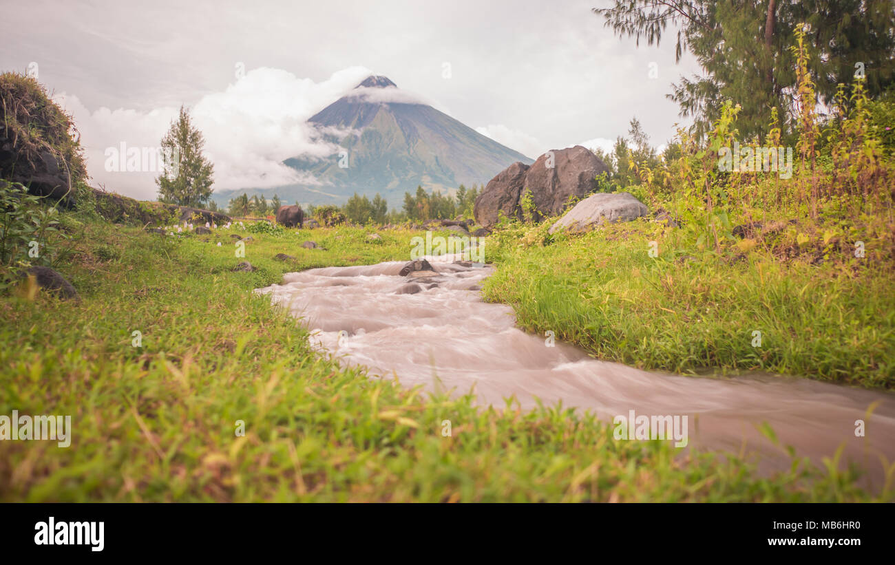 Foothills of the Mayon Volcano with flowing mountain rivers near ...