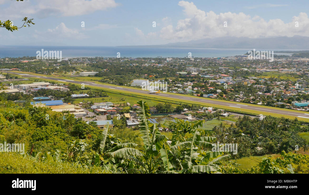 Panorama of the city of Legazpi on the background of the airport. Luzon ...