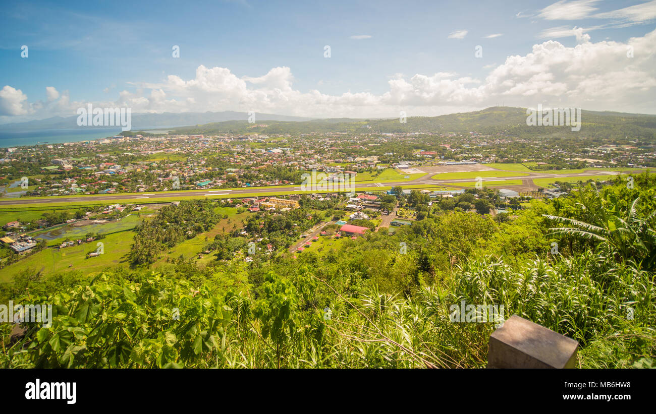 Panorama of the city of Legazpi on the background of the airport. Luzon ...
