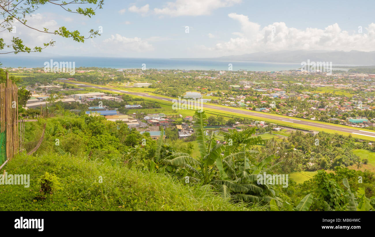 Panorama of the city of Legazpi on the background of the airport. Luzon ...
