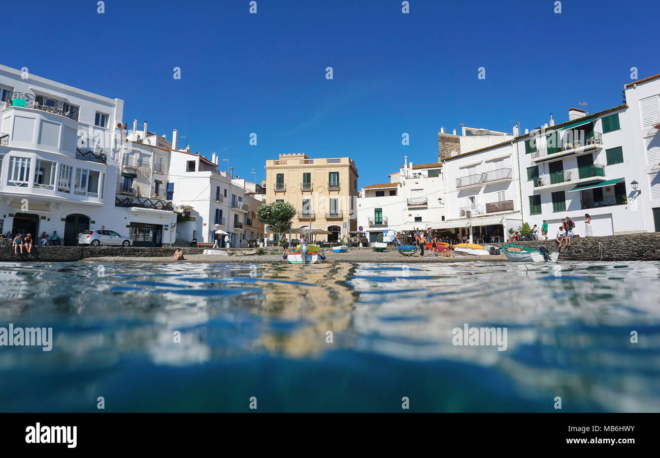 Seaside village of Cadaques, buildings on the waterfront with a small ...
