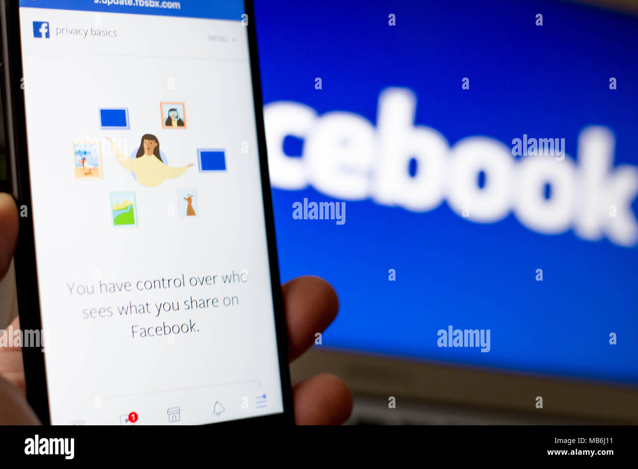 In a photo illustration, a screen from the Facebook app is seen on an ...