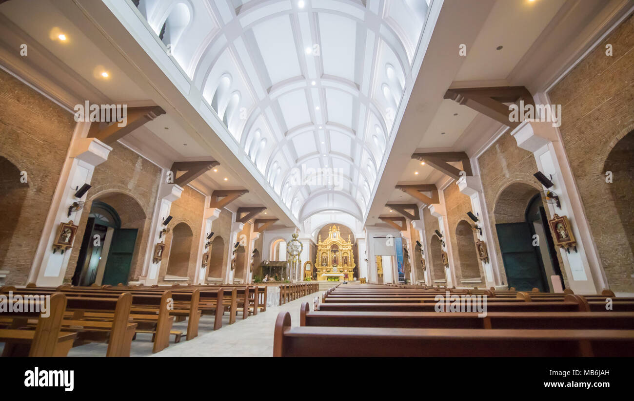 Interior inside the Catholic temple in the Philippines. Parishioners ...