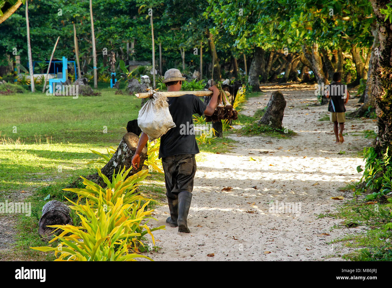 Local man walking through Lavena village on Taveuni Island, Fiji ...