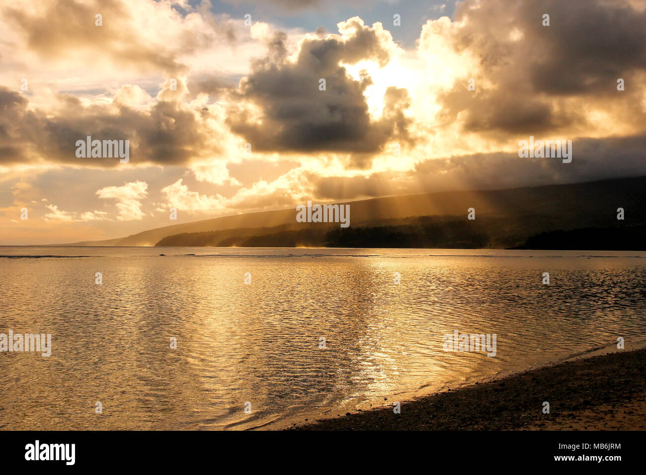 Sunset with rays in Lavena village on Taveuni Island, Fiji. Taveuni is ...