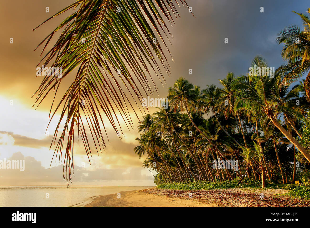 Colorful sunrise on the beach in Lavena village on Taveuni Island, Fiji ...