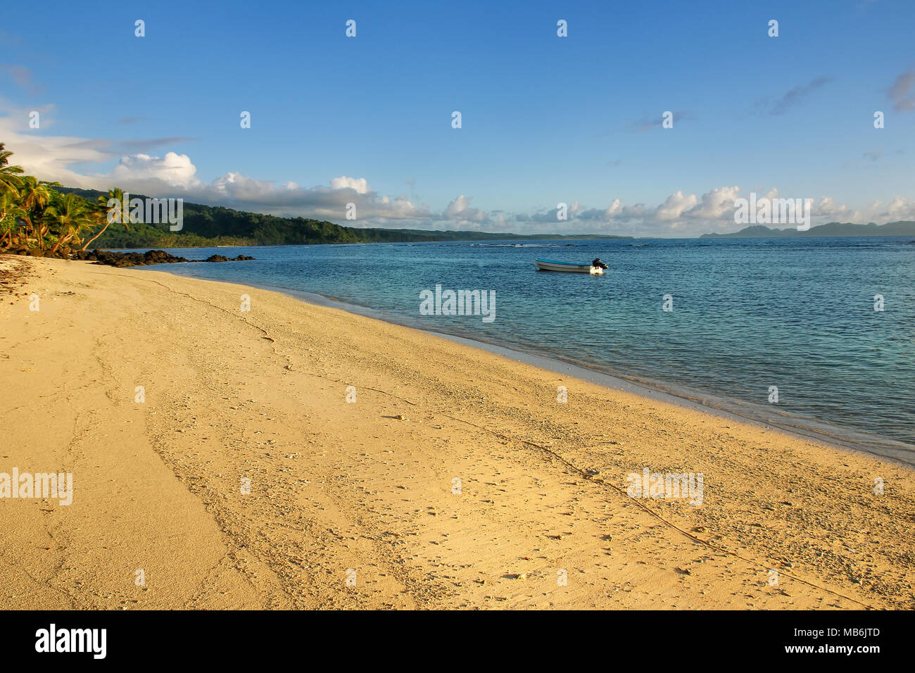 Sandy beach in Lavena village on Taveuni Island, Fiji. Taveuni is the ...