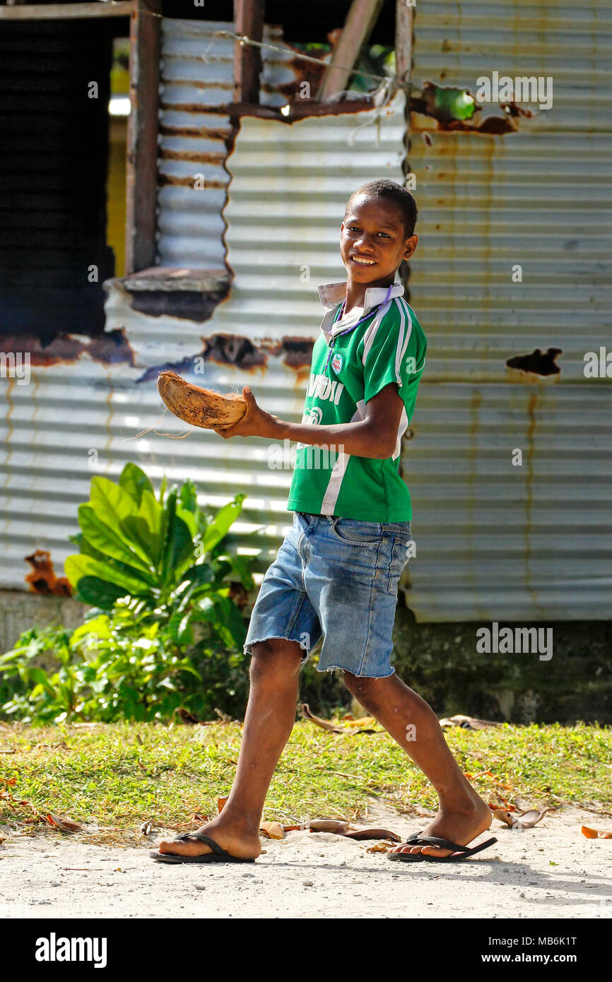 Local boy walking around Lavena village on Taveuni Island, Fiji ...
