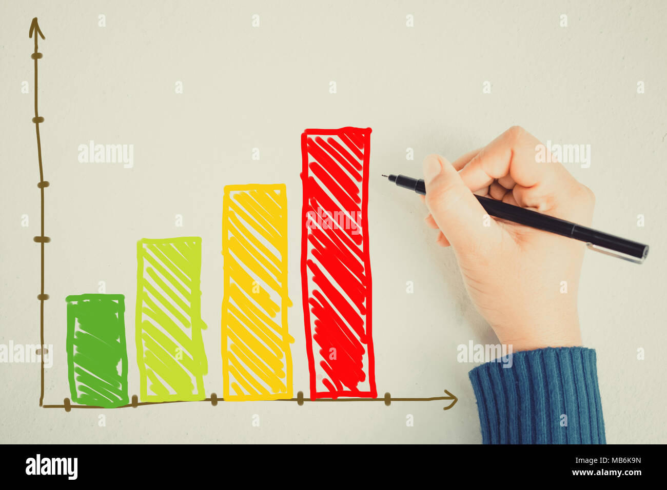 Human hand with pencil colorful graph on wall background Stock Photo ...