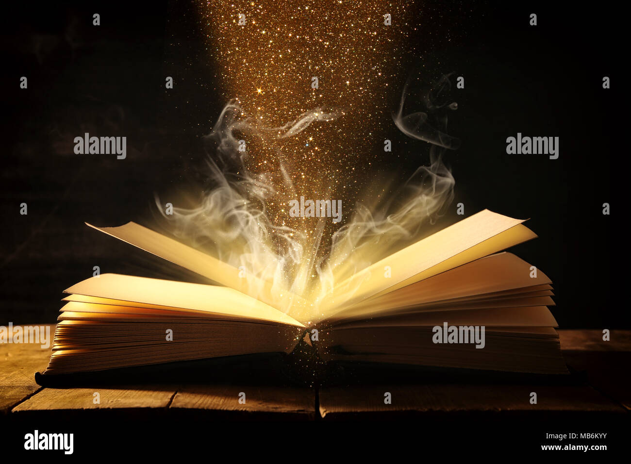 image of open antique book over wooden table Stock Photo - Alamy