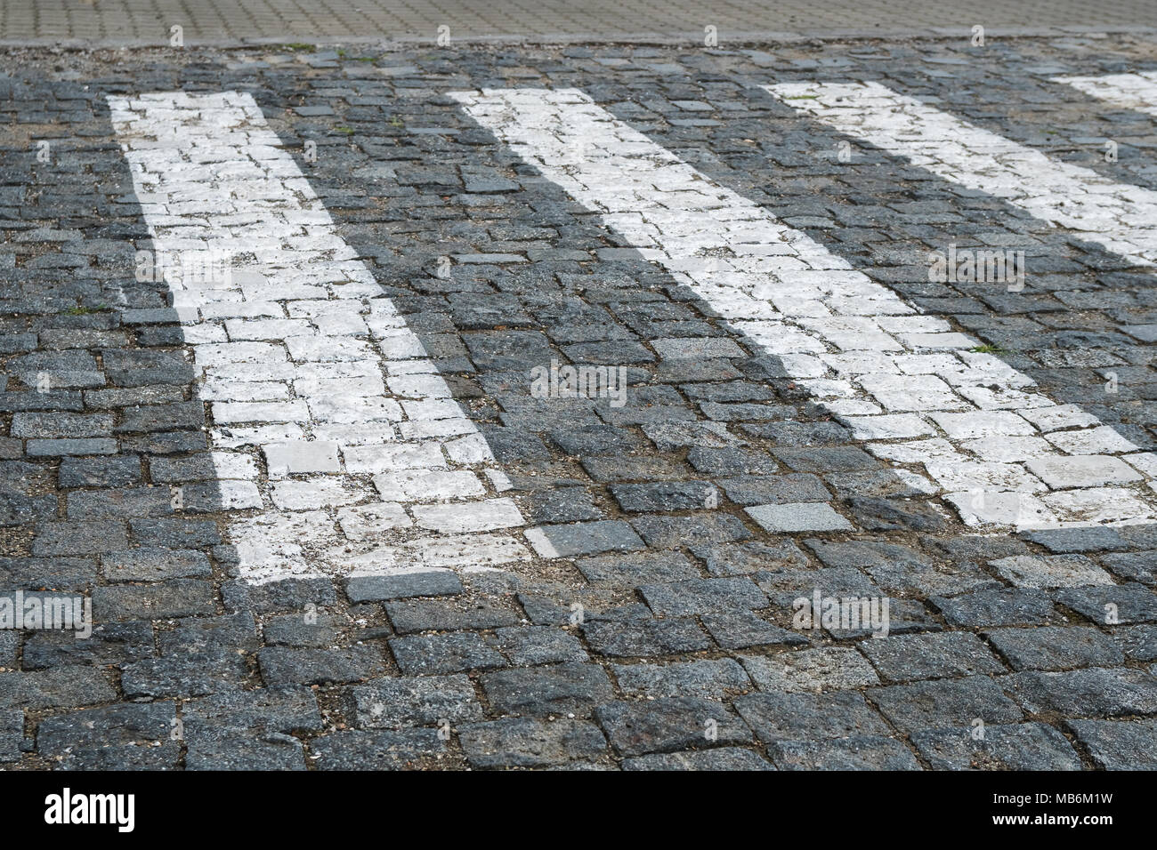 Urban street painted floor tiles, stone construction Stock Photo - Alamy