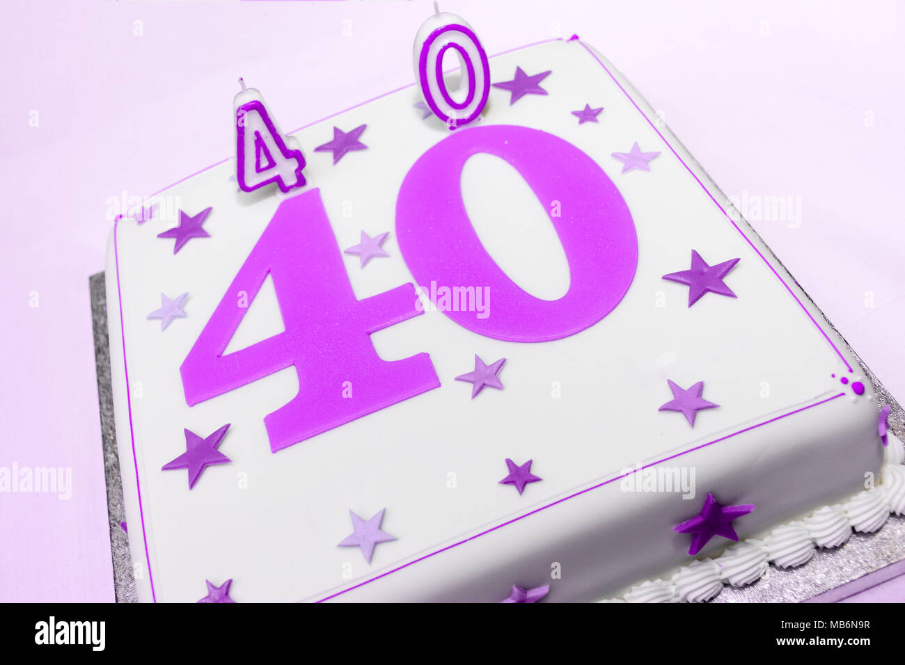 40th White Birthday Cake with Pink / Purple Decorations Stock Photo - Alamy