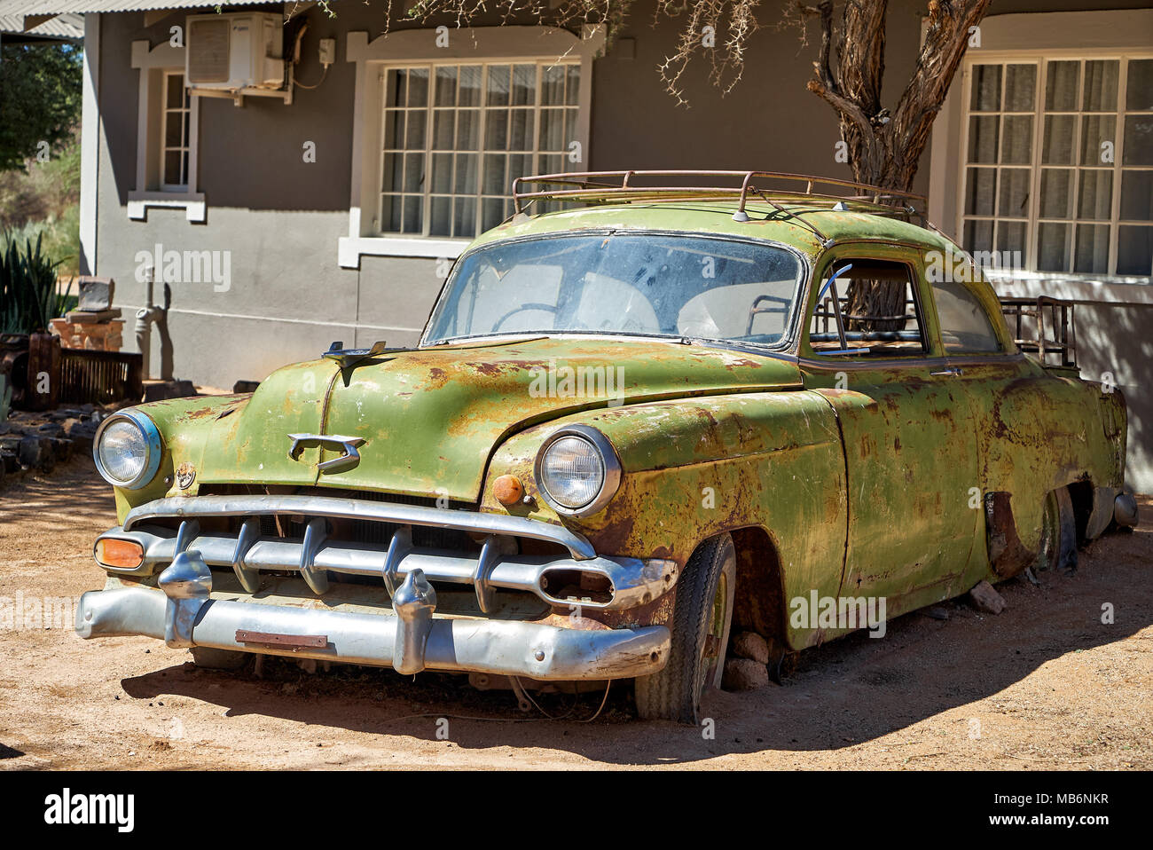 rusty classic car as decoration in Canyon Road House, Namibia, Africa ...