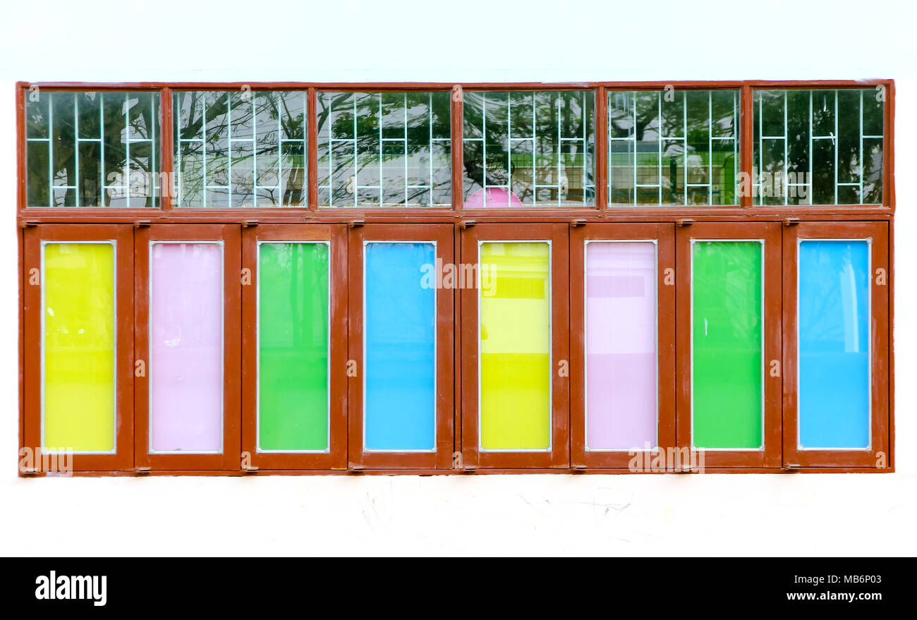 Part of the house with multi-colored windows Stock Photo - Alamy