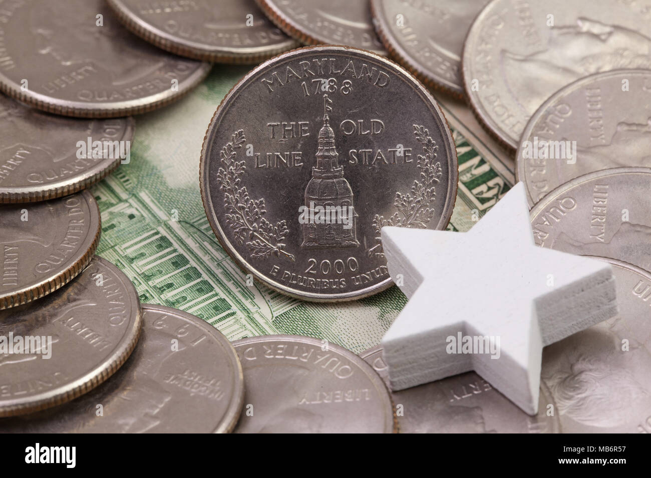 A quarter of Maryland, quarters of USA and white star. A circle of the ...