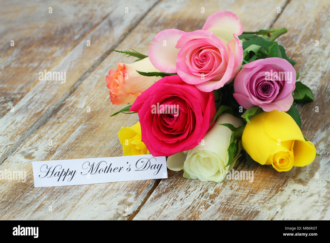 Happy Mother's day card with colorful roses bouquet on rustic wood ...