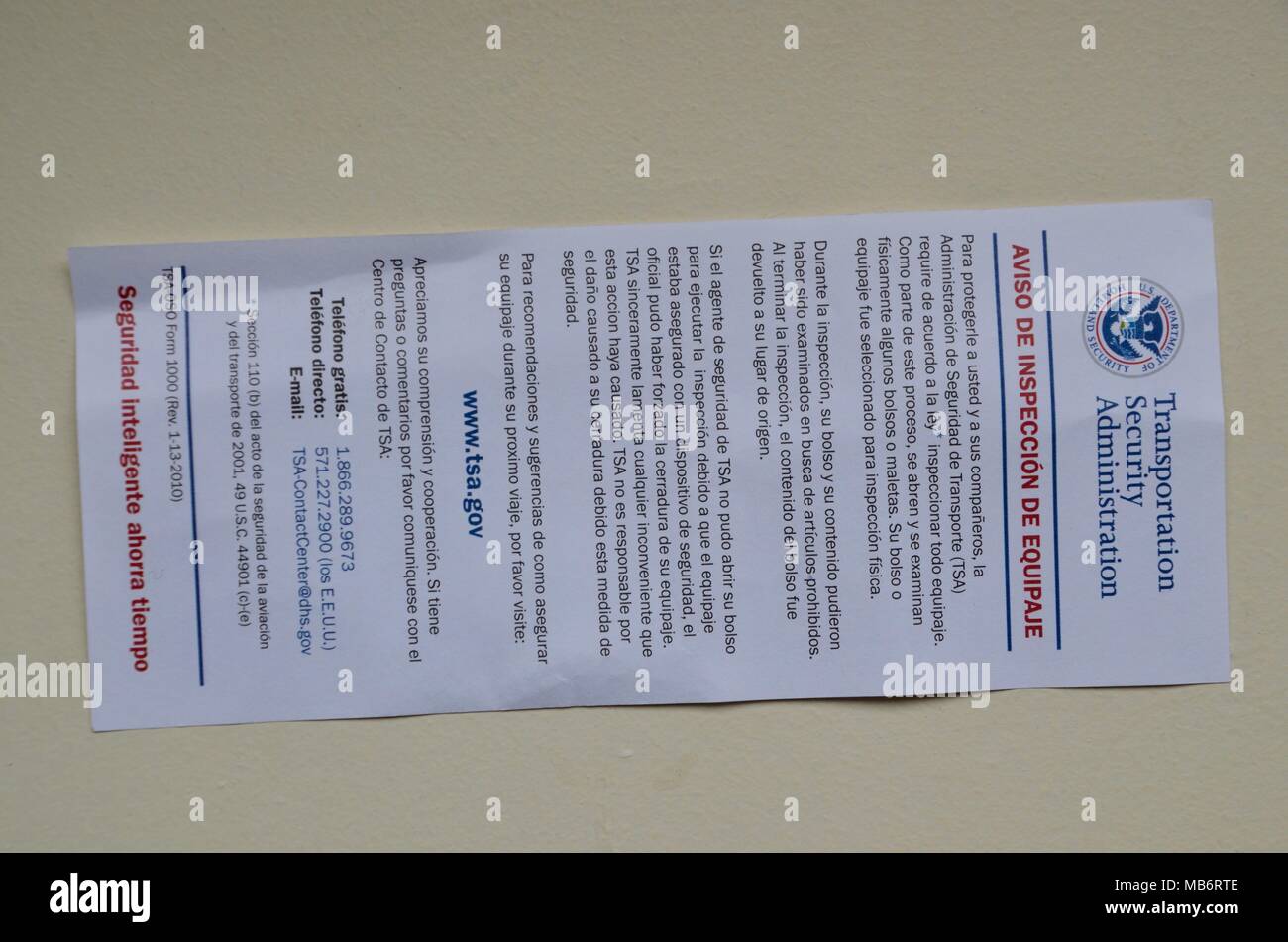 an spanishlanguage card for the USA notice of baggage inspection TSA ...